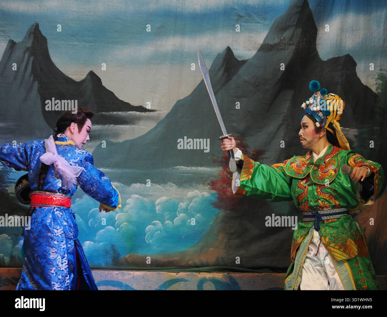 Taiwanese Opera Performers in a Dramatic Sword Fight Scene Stock Photo ...