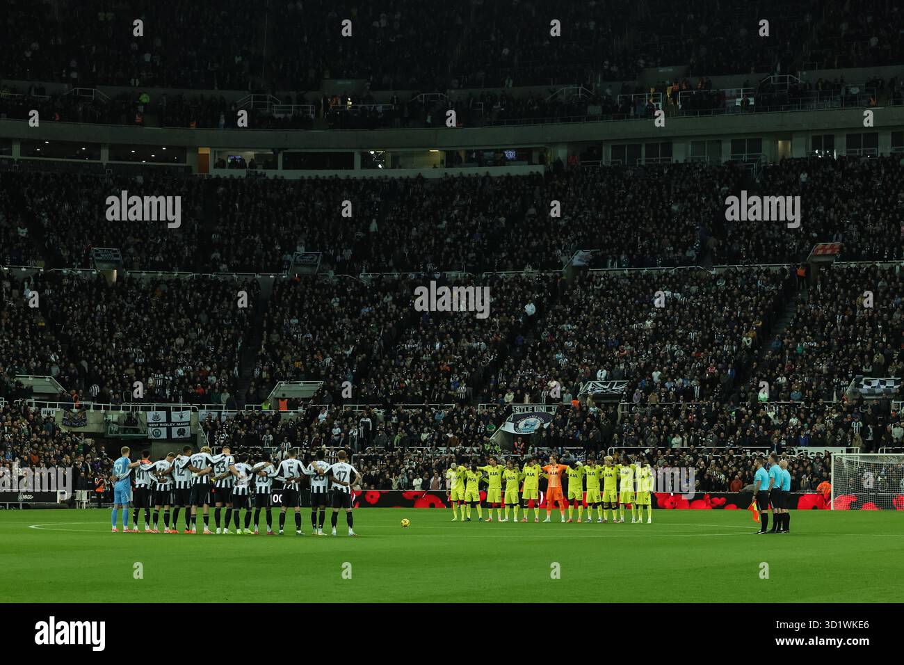Players officials and fans hold a minutes silence as part of armed ...