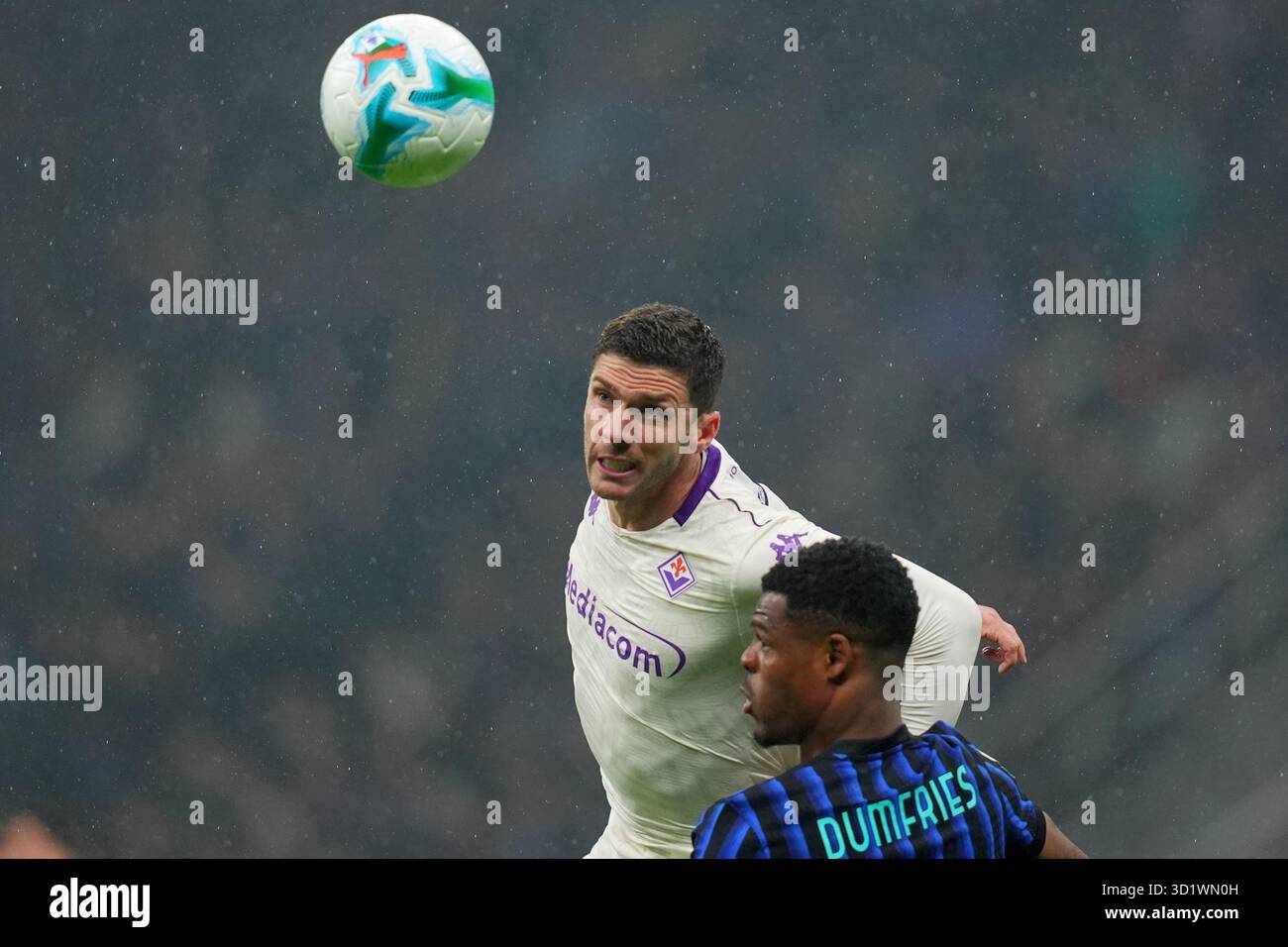 Inter MilanÕs Denzel Dumfries fight for the ball with Fiorentina's ...