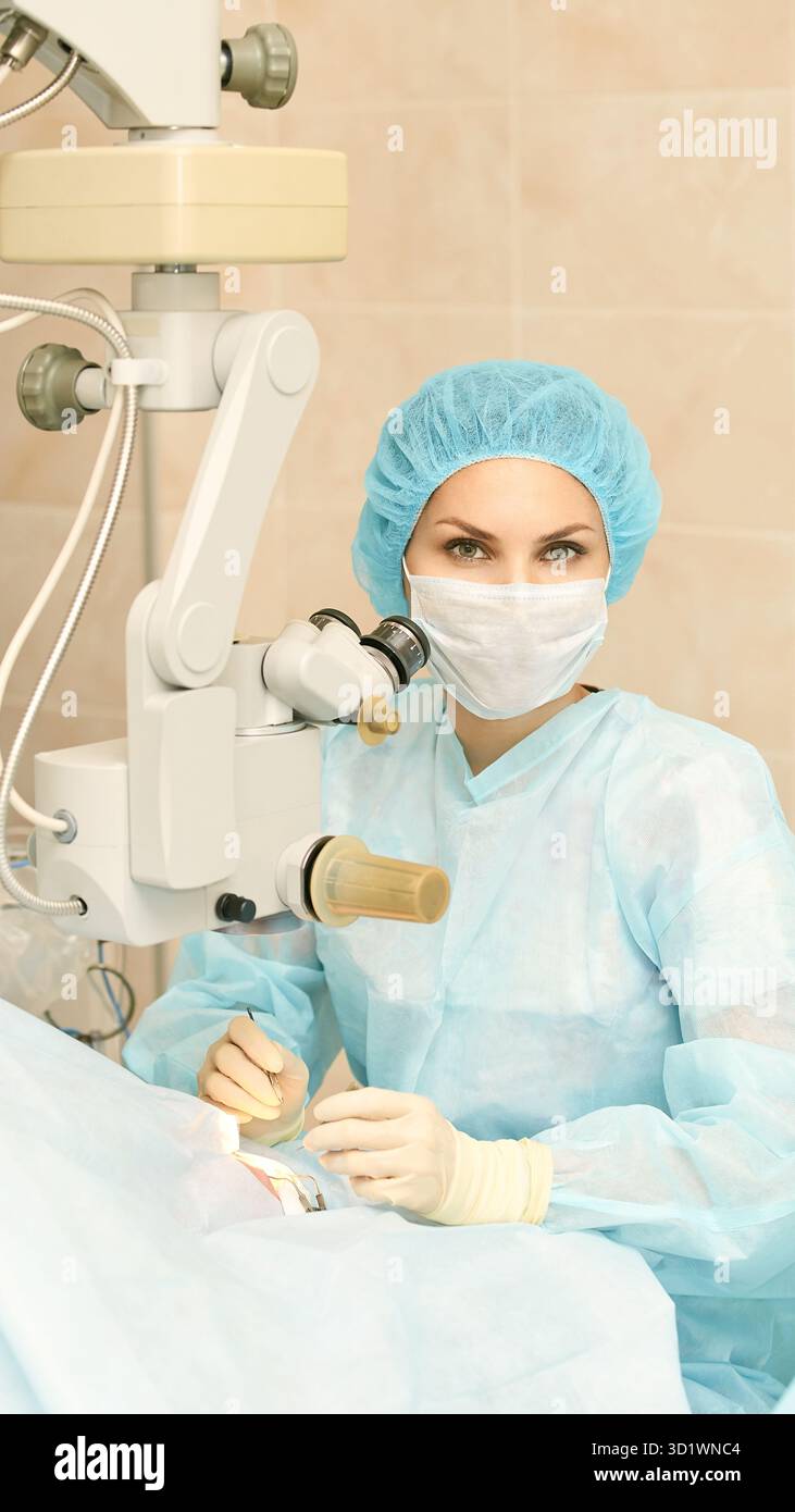 Ophthalmology laser microscope operation. Doctor in clinic. Patient eye ...