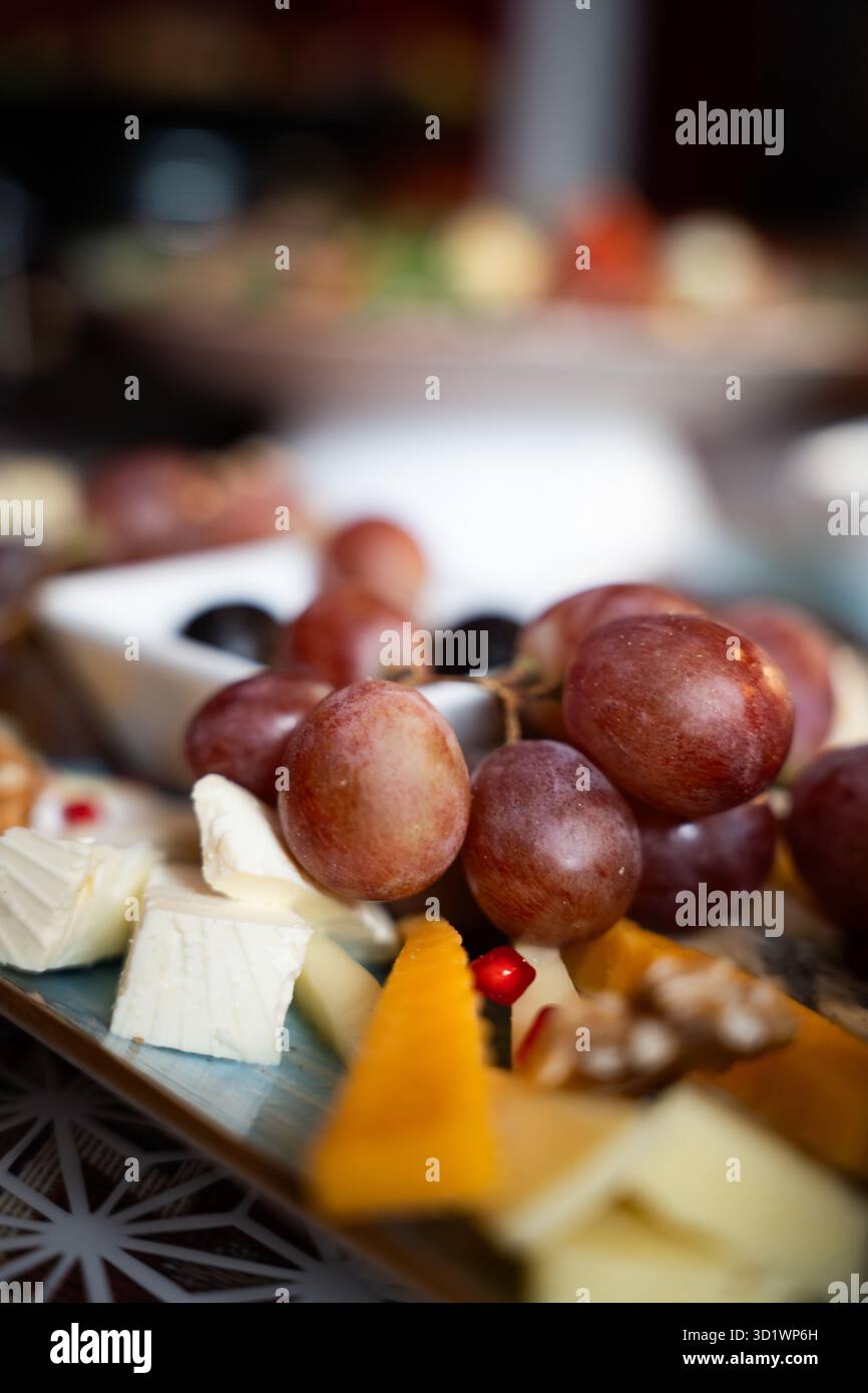 Cheese Platter with Grapes and Walnuts Close-Up Stock Photo - Alamy