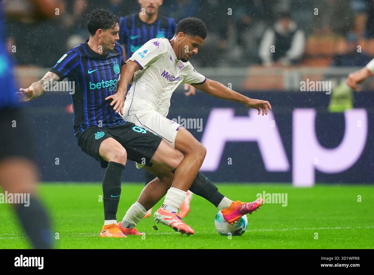 Inter MilanÕs Alessandro Bastoni fight for the ball with FiorentinaÕs ...