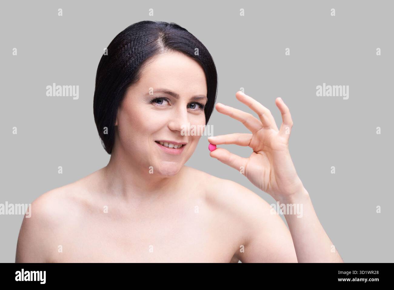 Woman holding object hi-res stock photography and images - Alamy