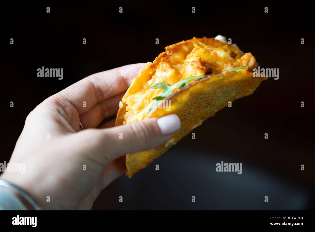 Hand holding mexican taco hi-res stock photography and images - Alamy