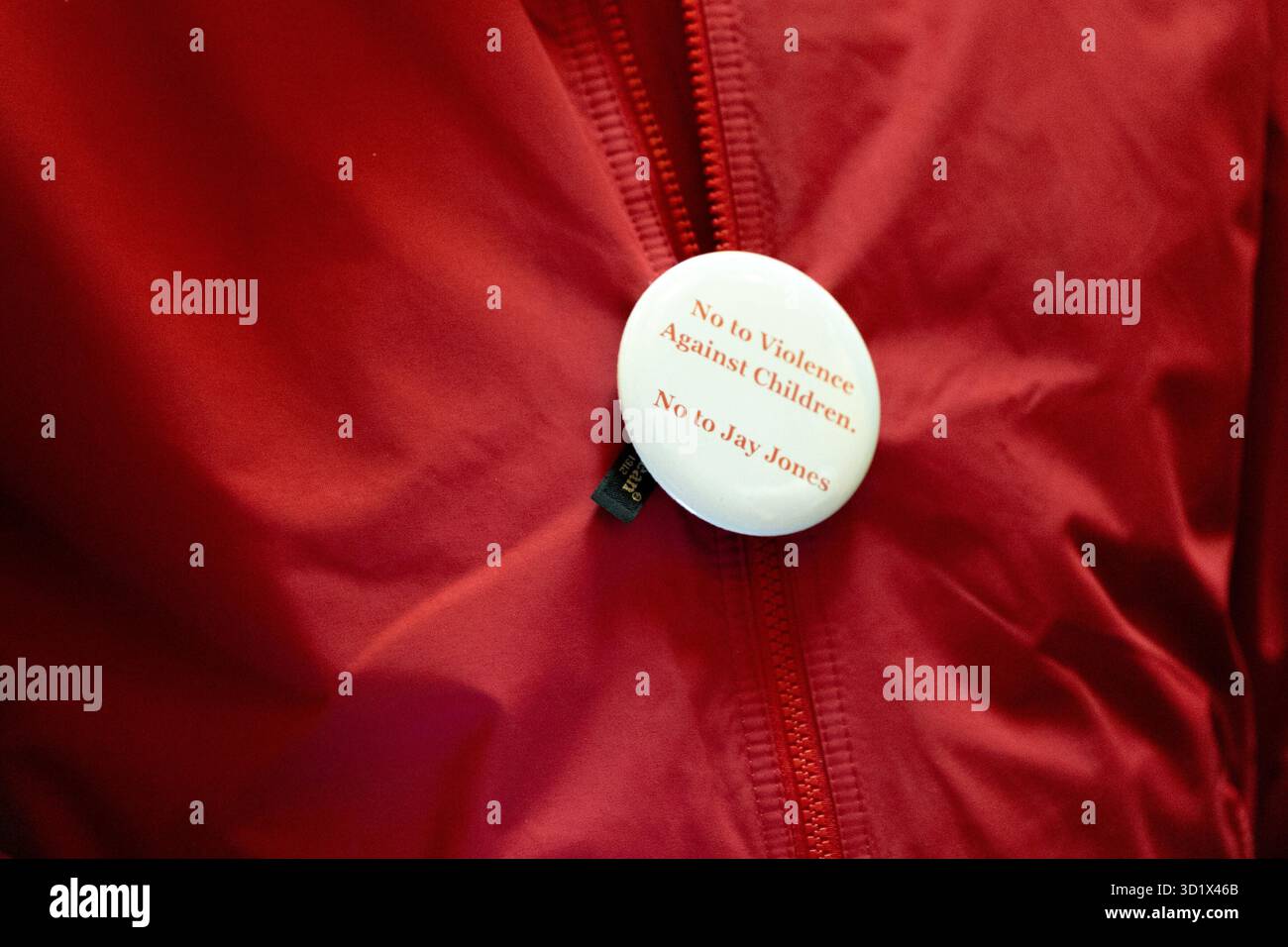 A visitor wears a pin against Democratic attorney general candidate Jay ...