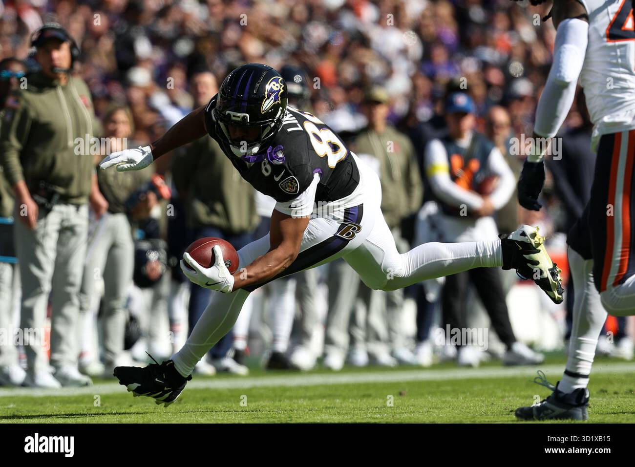 Baltimore Ravens tight end Isaiah Likely (80) runs with the ball after ...