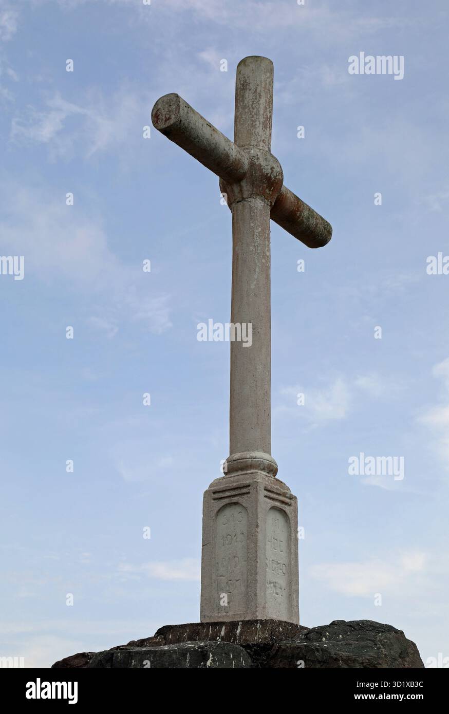 Colonial era cross outside the Church of Saint Mary Queen in Mbini ...