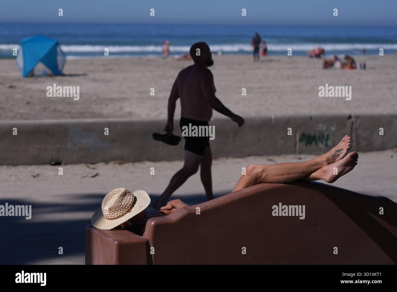 Harry Spiller takes a break from reading on a bench alongside La Jolla ...