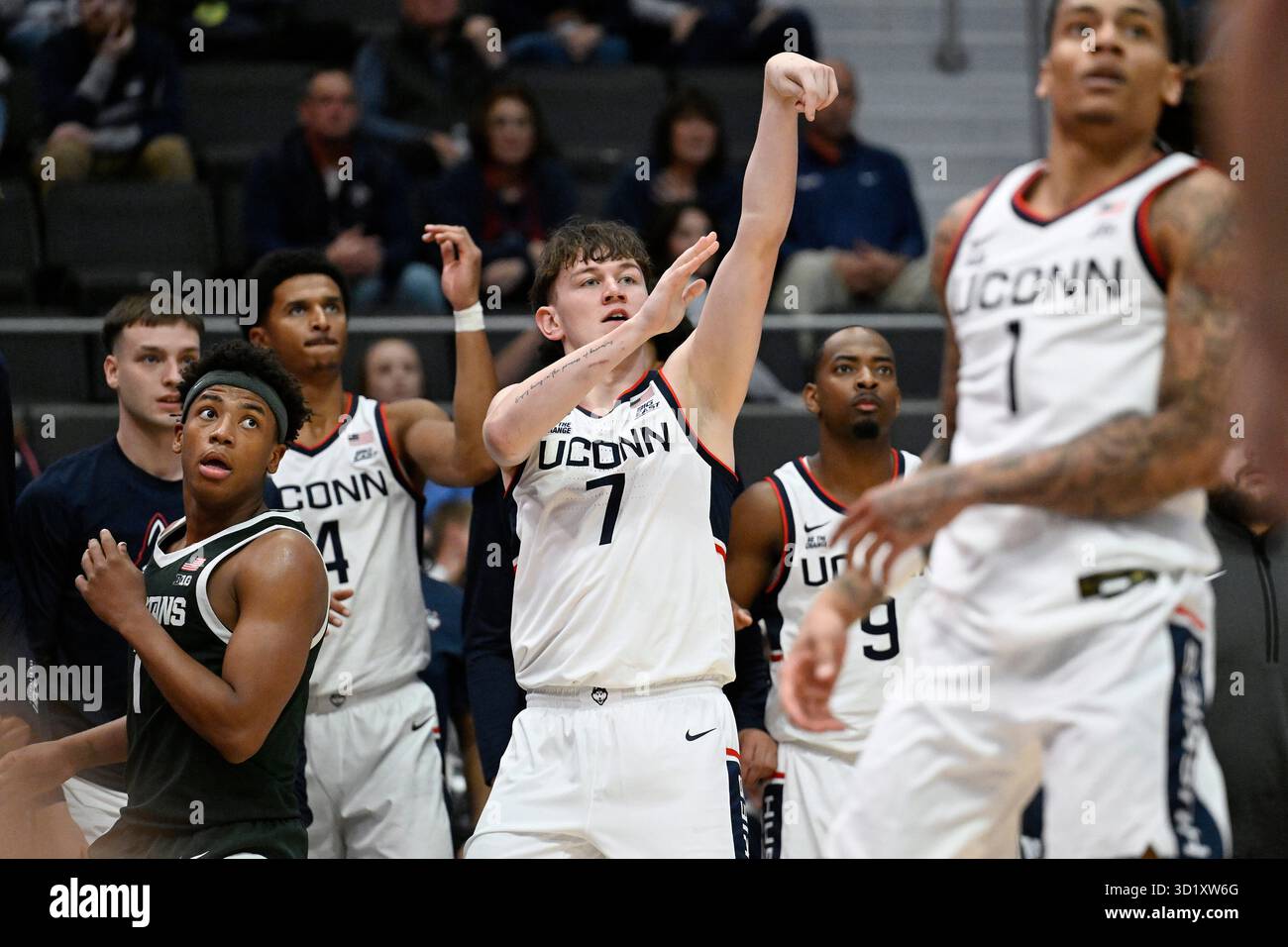 UConn guard Jacob Furphy (7) shoots during the second half of an NCAA ...