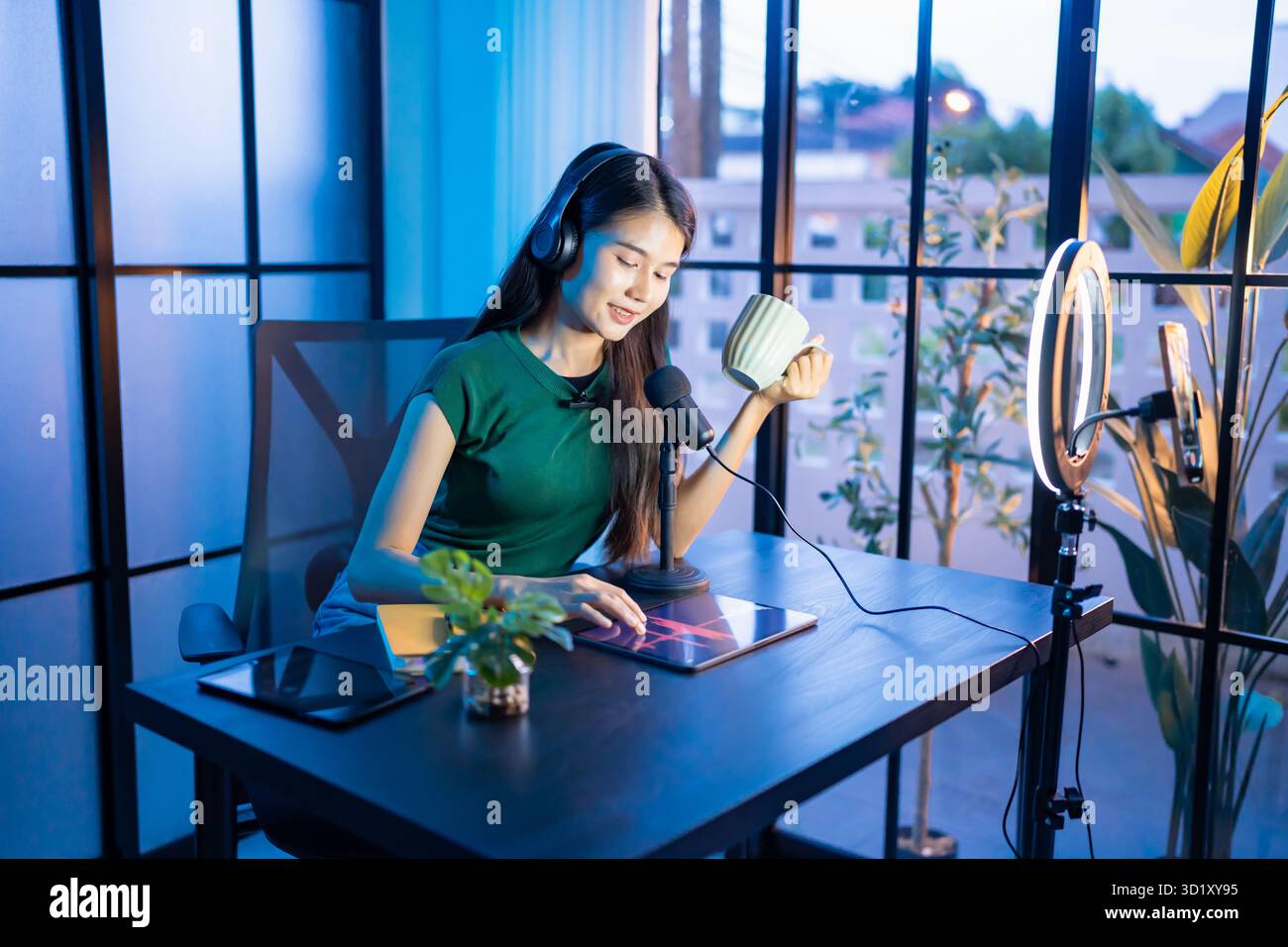 Content creator Young asian woman influencer creating content in home ...