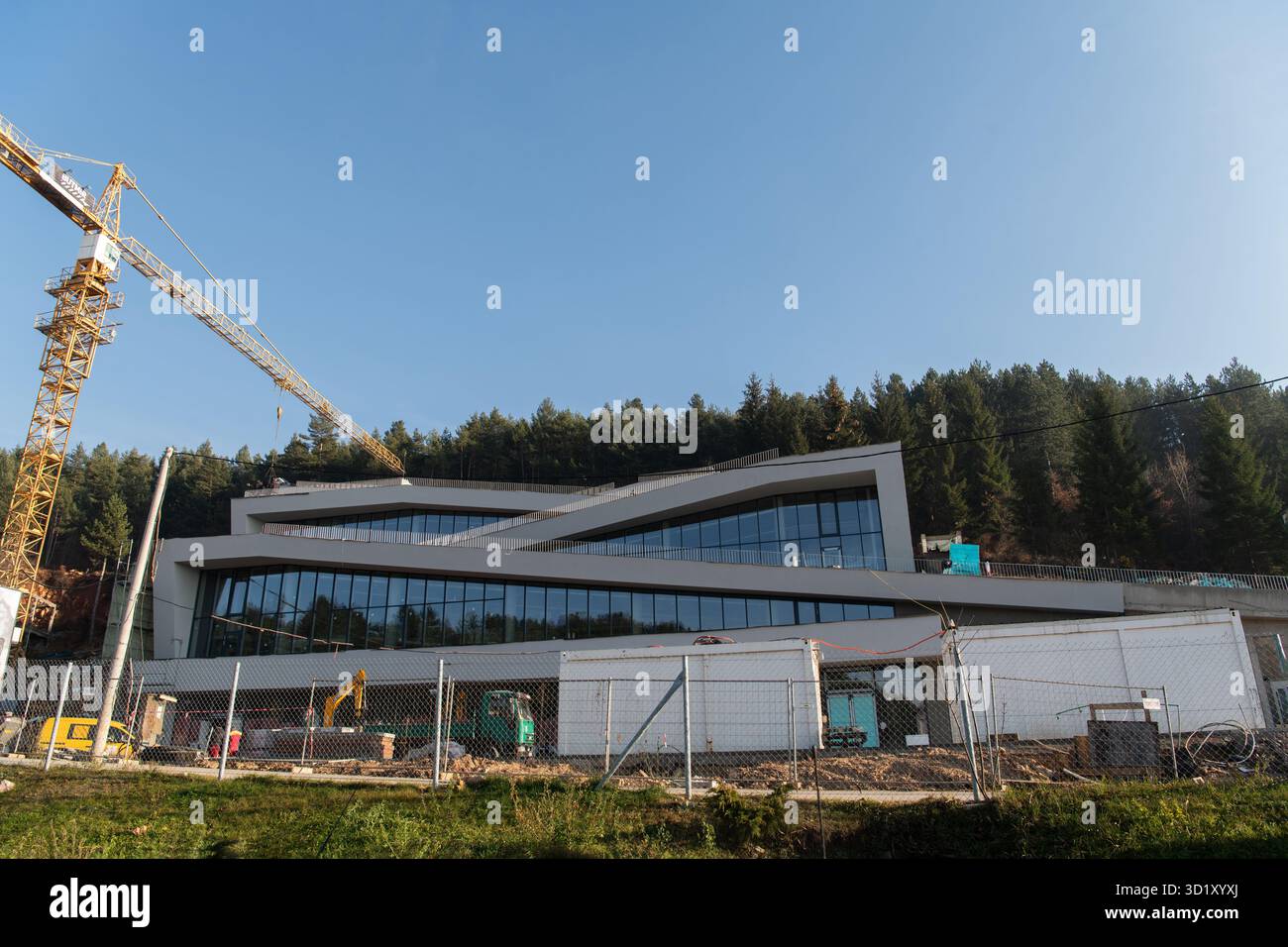The exterior of a business building under construction is surrounded by ...