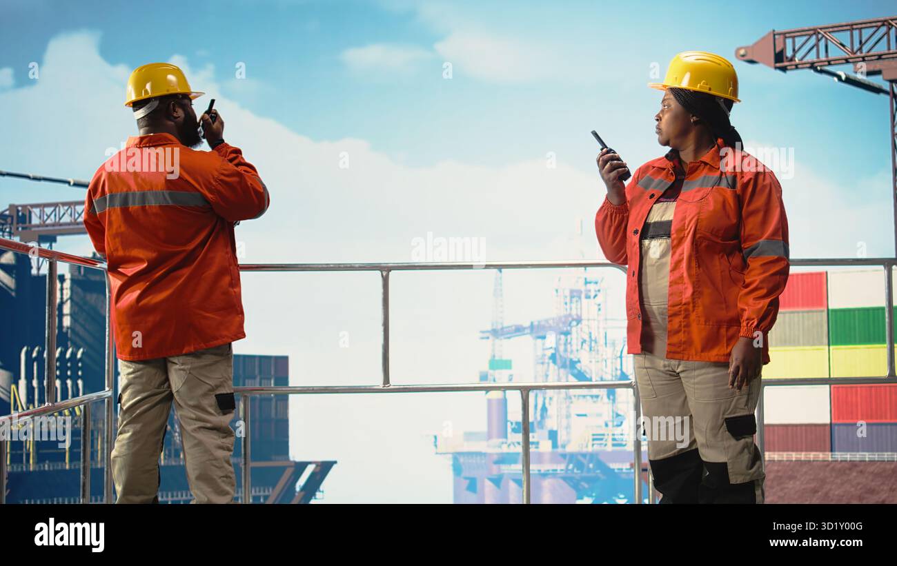 Drilling barge engineers use two way radio to communicate with ...
