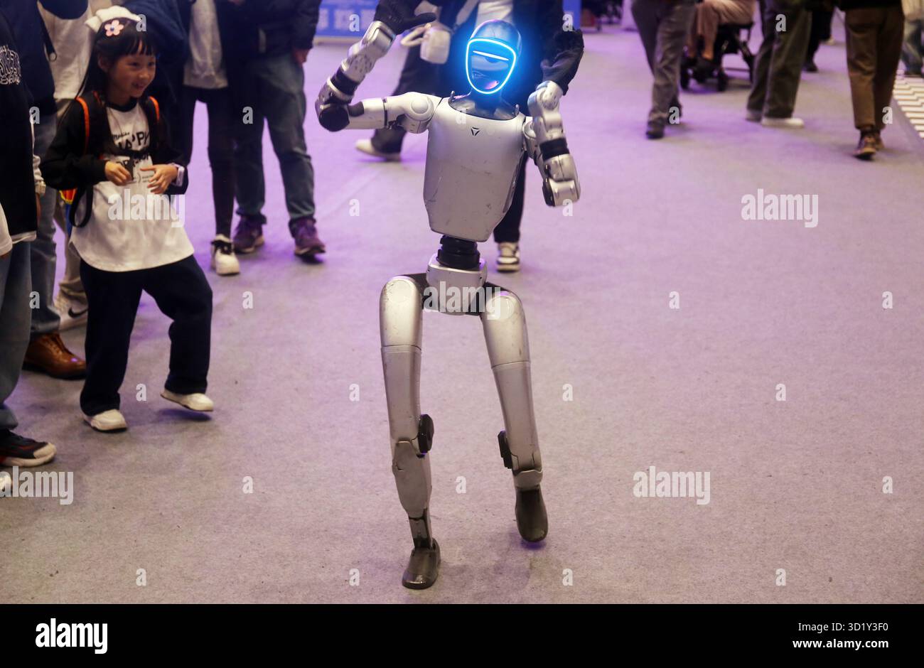 Tourists visit a Unitree G1 robot dancing Charleston dance at GLOBAL AI ...