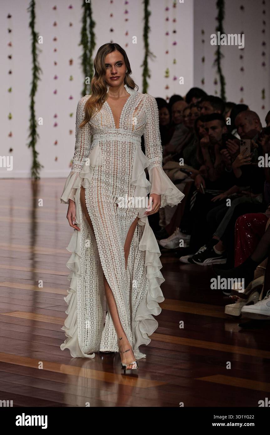 Madrid, Spain. 29th Oct, 2025. A model walks the catwalk during the ...