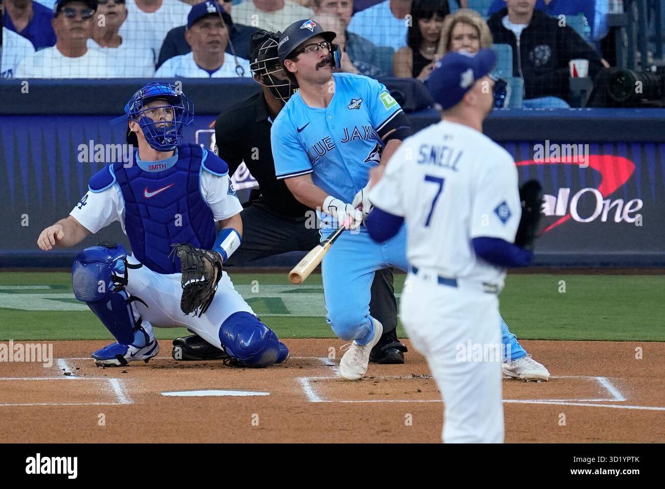Toronto Blue Jays' Davis Schneider watches his solo home run off Los ...