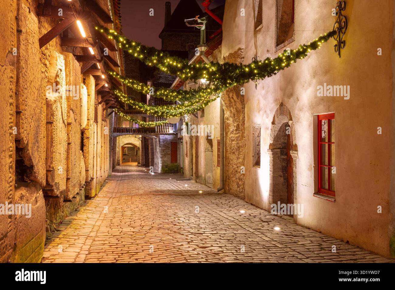 Christmas lights over medieval St Catherine's Passage at night in ...