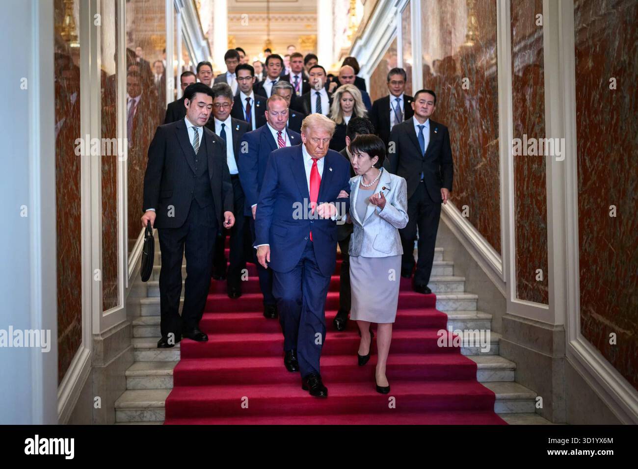 President Donald J. Trump walks arm in arm with Japan’s Minister of ...