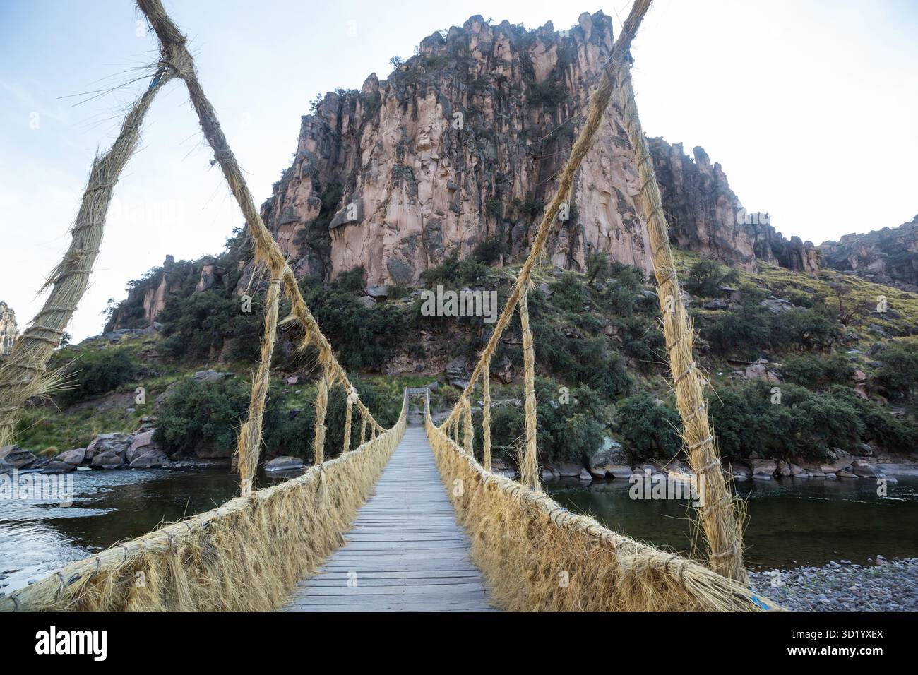 Authentic wooden and grassy bridge across river in Peru Stock Photo - Alamy
