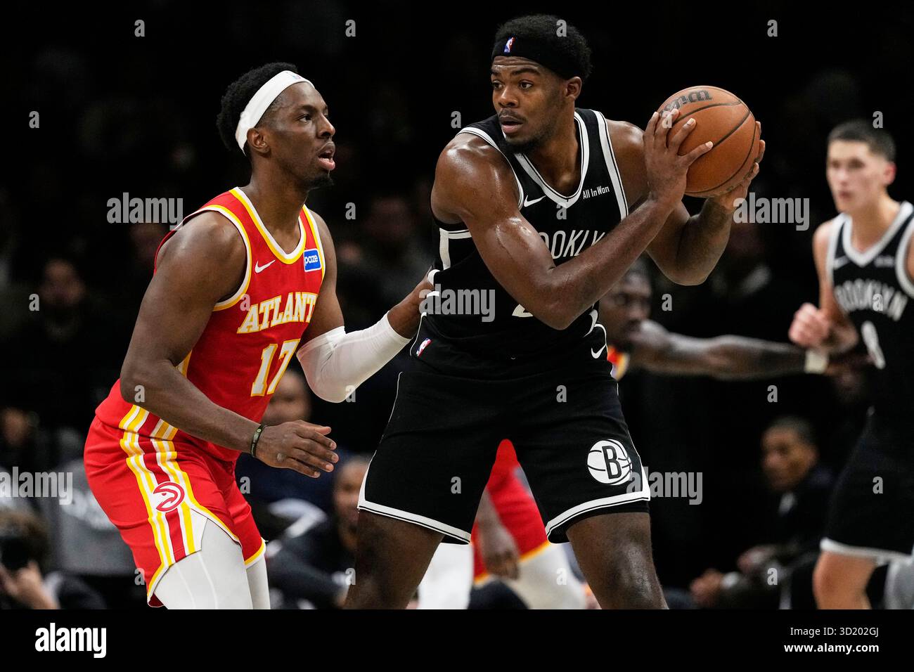Atlanta Hawks' Onyeka Okongwu (17) defends Brooklyn Nets' Day'Ron ...