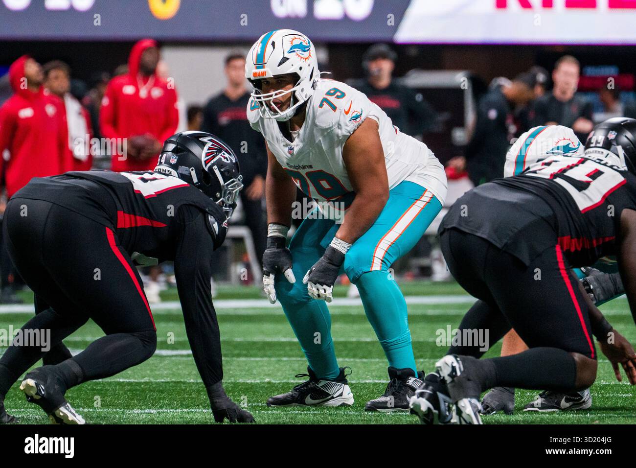 Miami Dolphins offensive tackle Larry Borom (79) lines up during the ...