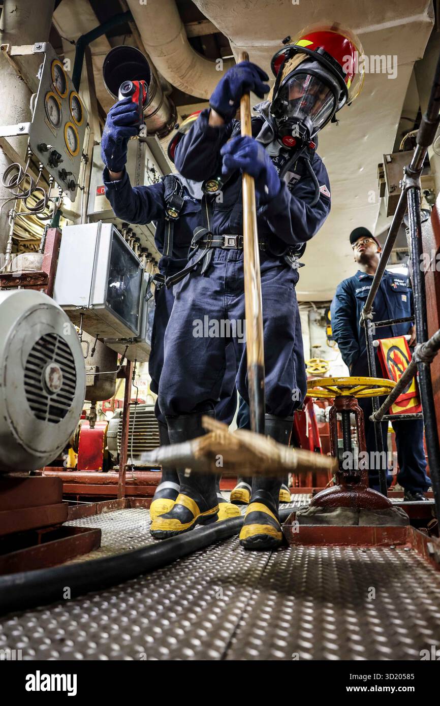 CARIBBEAN SEA (Sept. 27, 2025) Sailors smother a simulated hot spot on ...