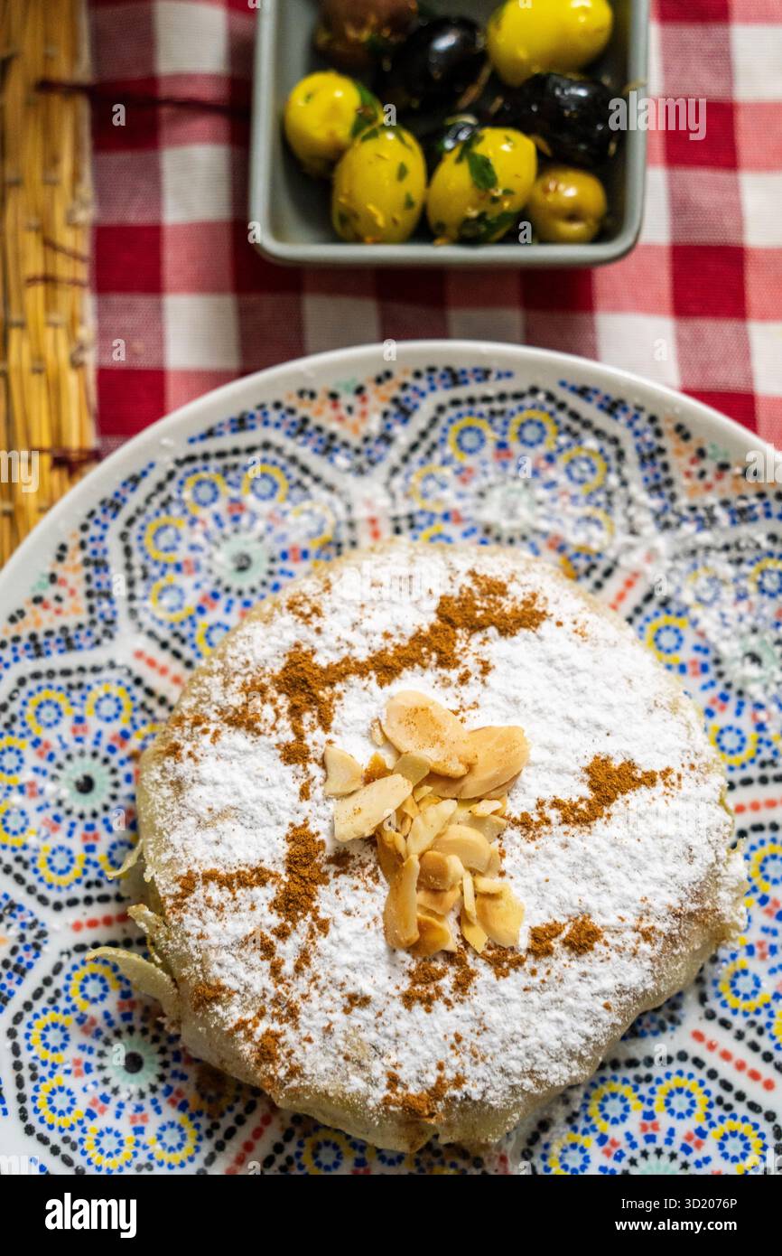 Moroccan pastilla, puff pastry filled with onion, chicken, parsley, and ...