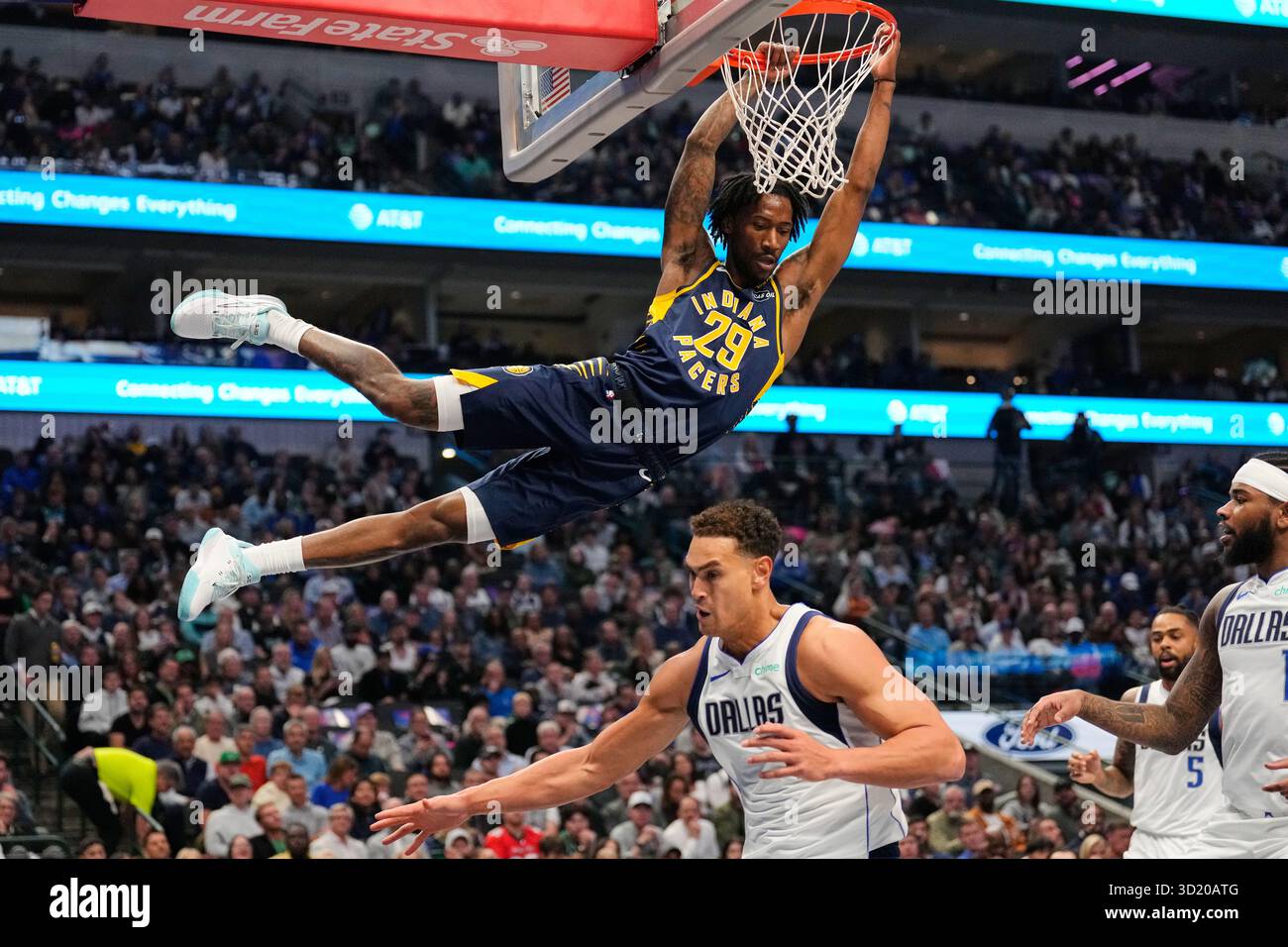 Indiana Pacers guard Quenton Jackson (29) follows through on a dunk over Dallas Mavericks ...