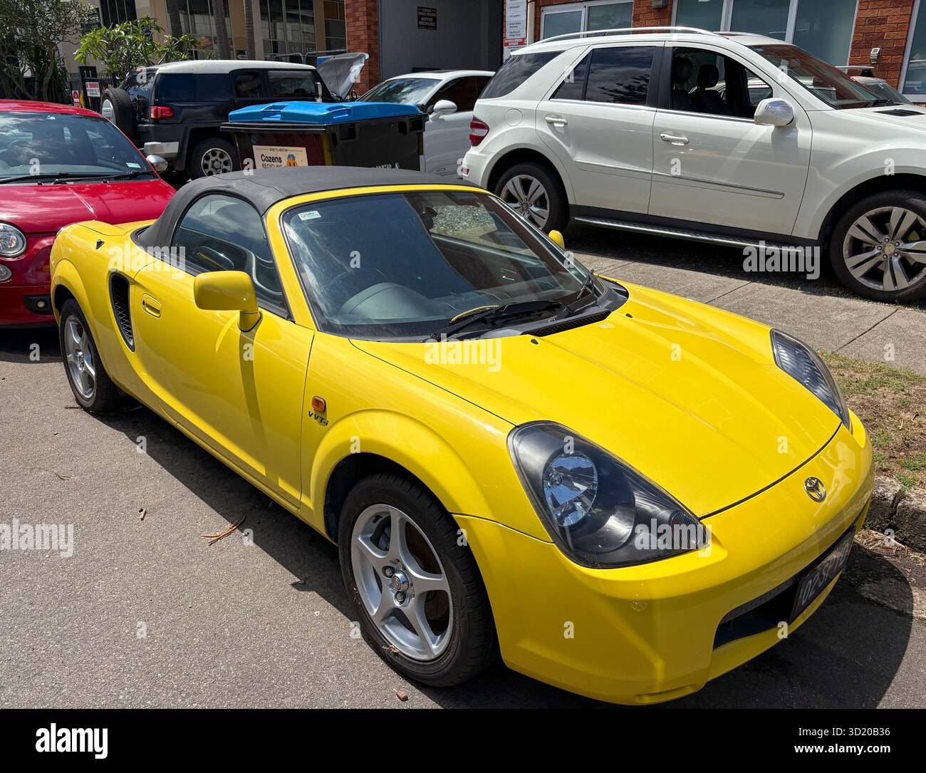 Toyota MR2 Spyder convertible two door sports car, yellow, parked in ...