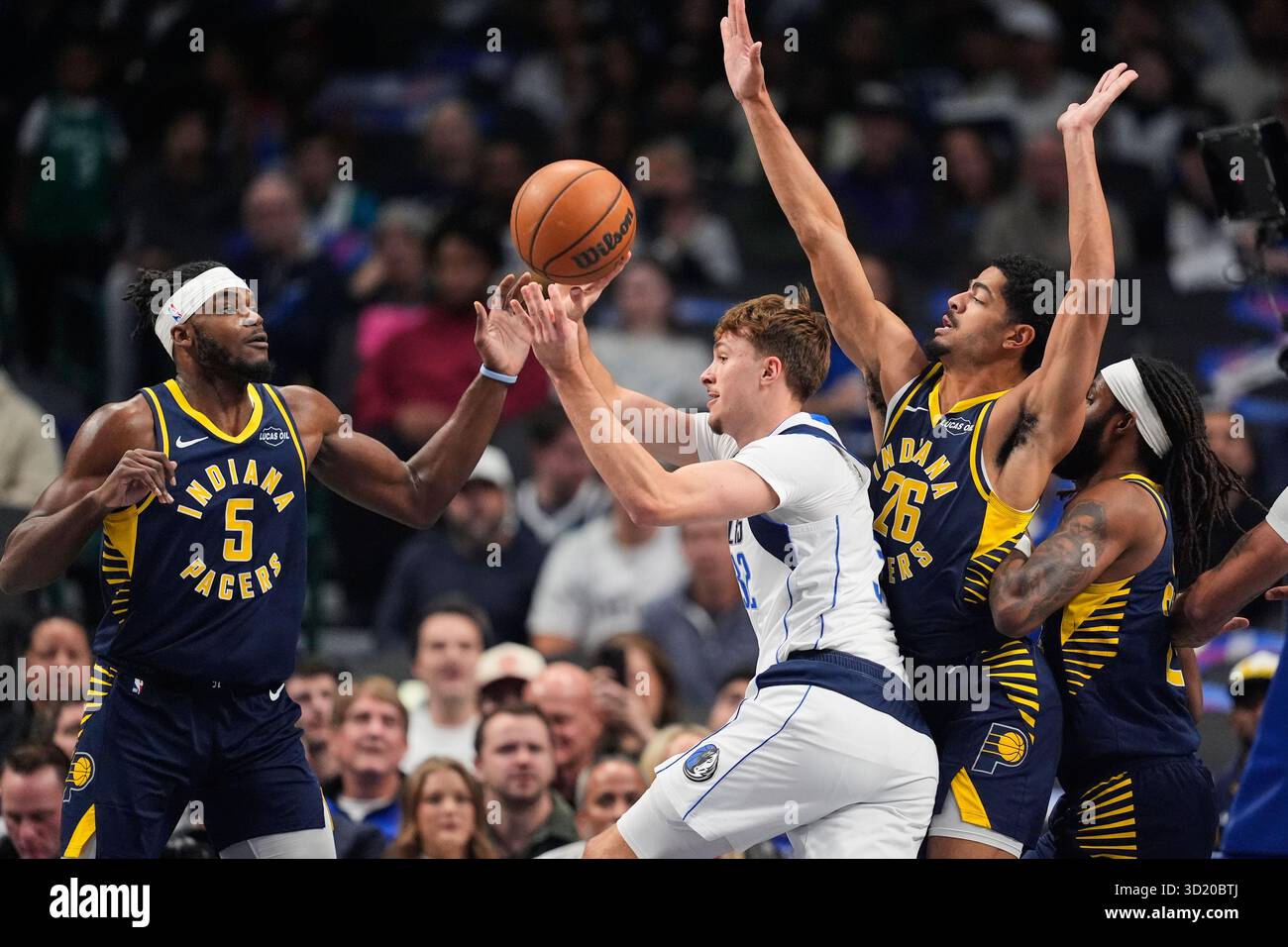 Dallas Mavericks forward Cooper Flagg, second from left, makes a pass ...
