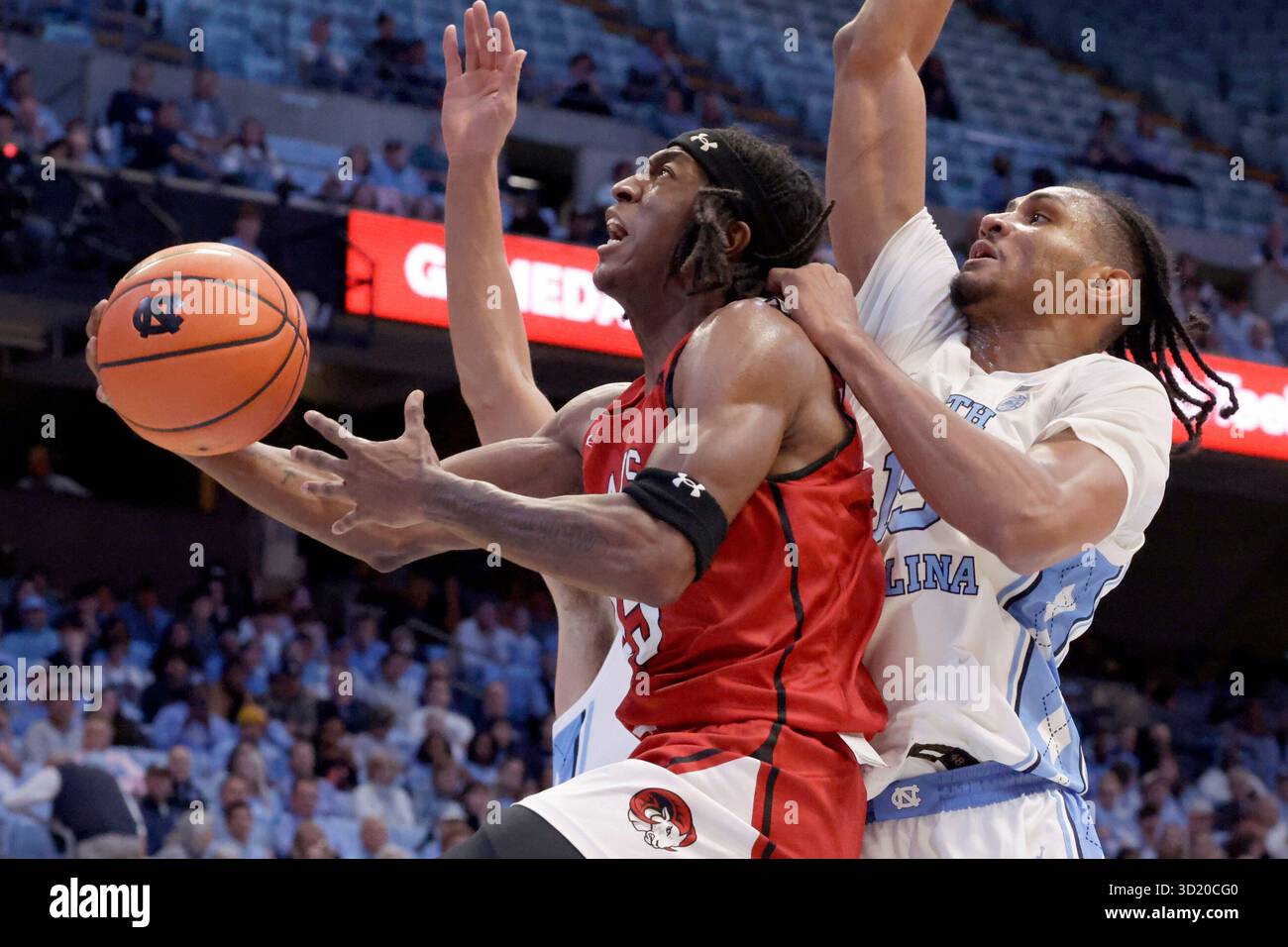 Winston-Salem State guard Isaiah Ray, left, drives around North ...