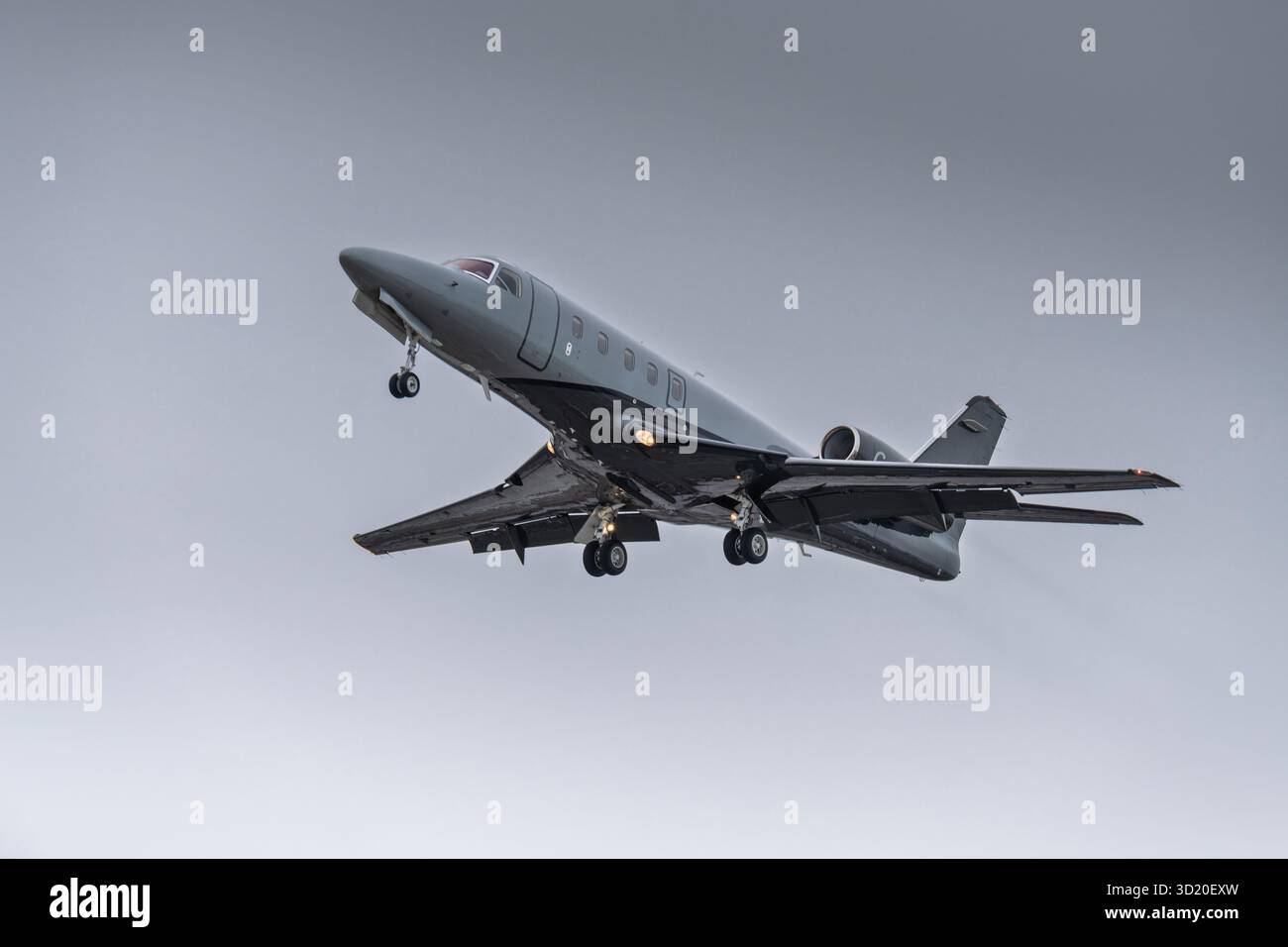 Airliner aircraft approaching airport with a dark moody sky Stock Photo ...