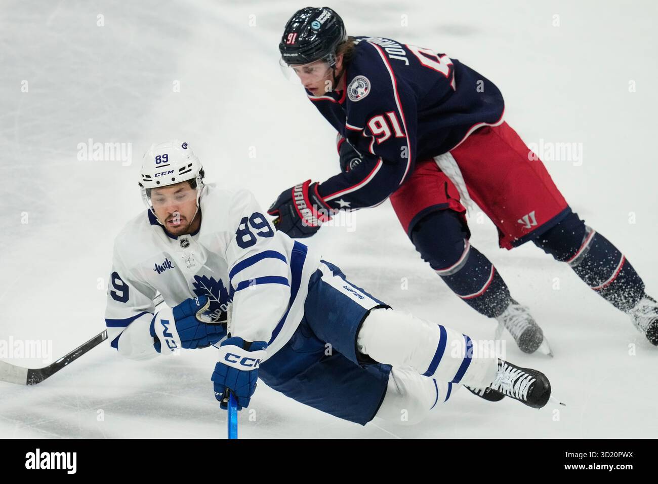 Toronto Maple Leafs left wing Nicholas Robertson (89) falls in front of ...