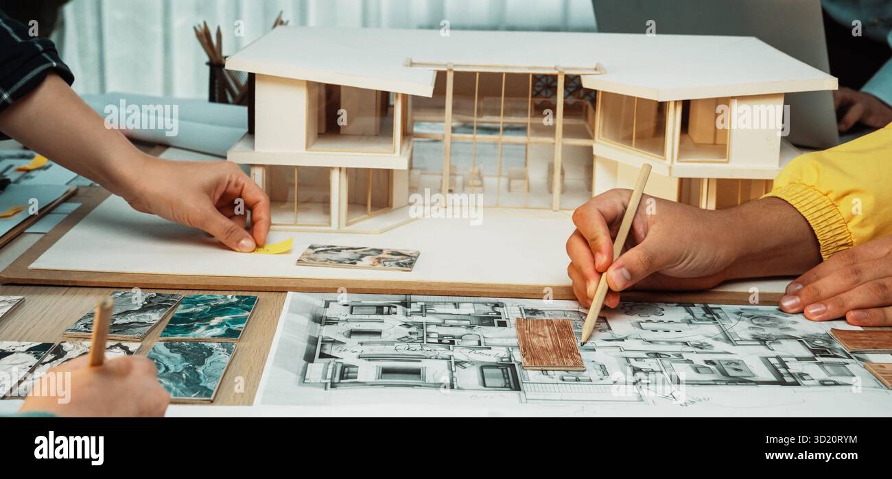 Designers collaborate on an architectural project, using models and ...