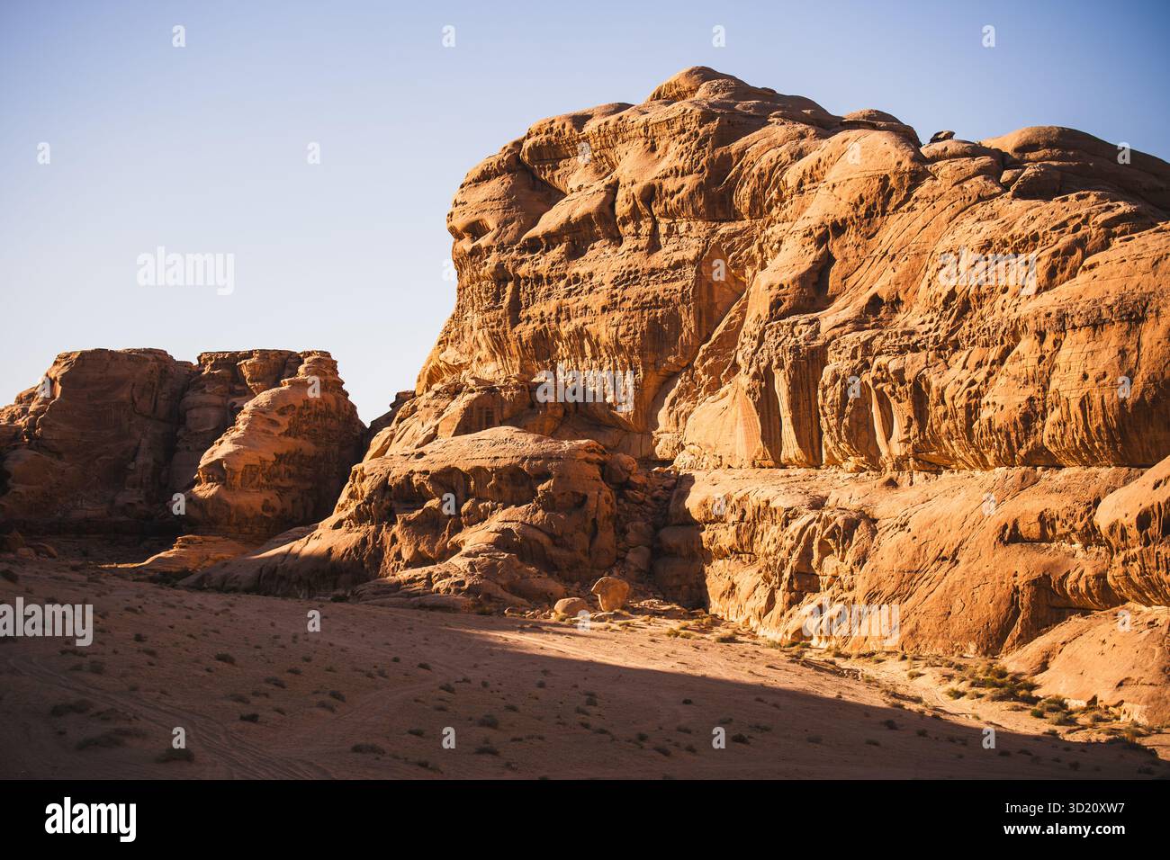 Sunlit sandstone formations in Wadi Rum desert, Jordan, showing ...