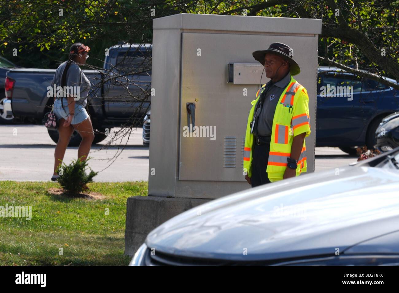 School crossing guard Anthony Taylor operates a traffic control box ...
