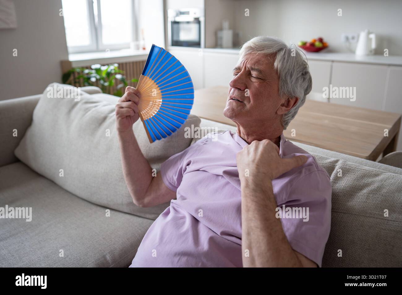 Sweating elderly man fanning suffering from suffocating heat. Aging ...