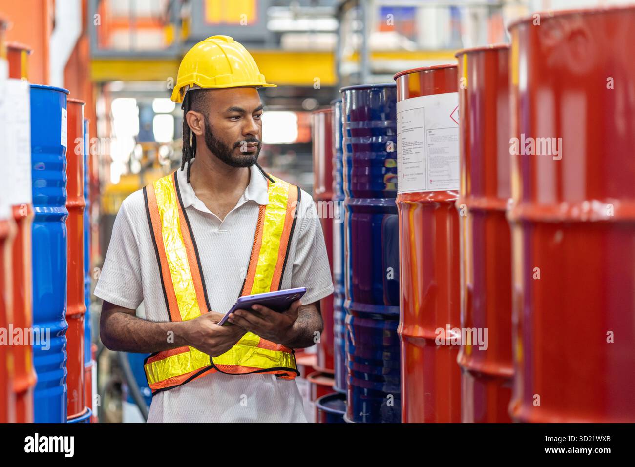 African black male worker working check in chemicals storage in ...