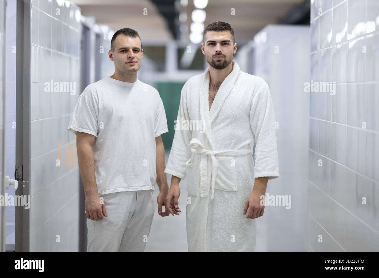 Medical Consultation in Spa Corridor.Two men discussing treatment ...