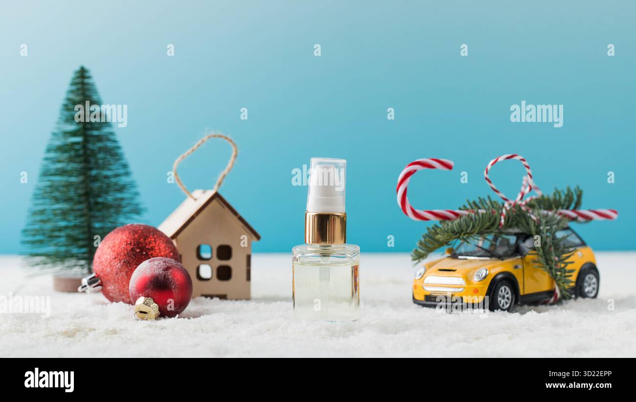 Christmas background with face serum on the snow on a blue background ...