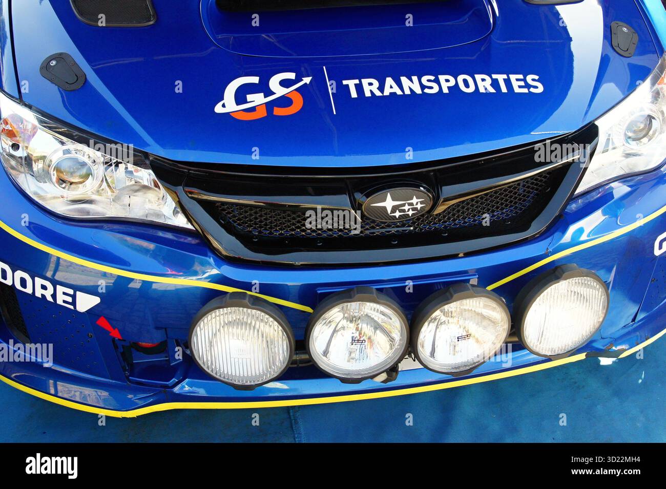 Front view of a blue Subaru Impreza WRX STI with GS Transportes logo ...