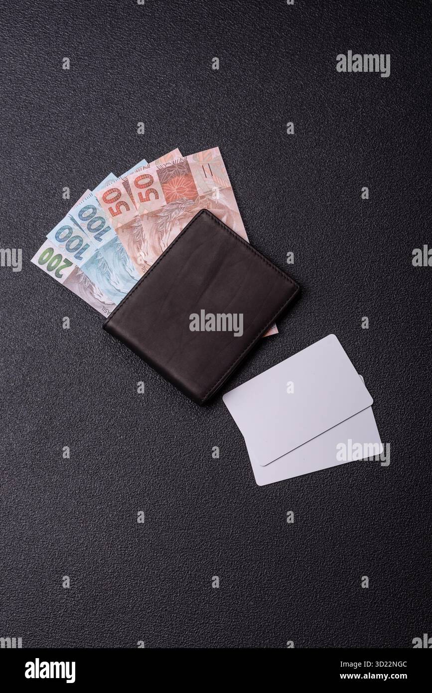 The white plastic card as a symbol of cashless payments on the ...