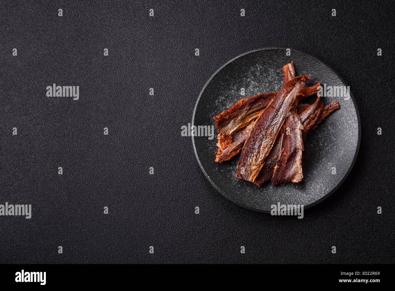 Dried salted fish as snacks or jerky, seafood as slices. Dried seafood ...