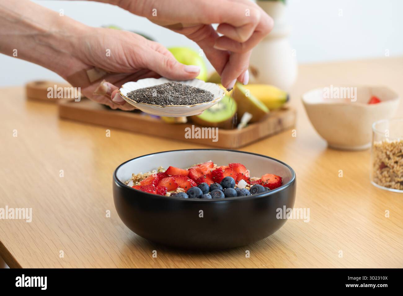 Preparing a healthy breakfast with fresh berries and chia seeds. Health ...