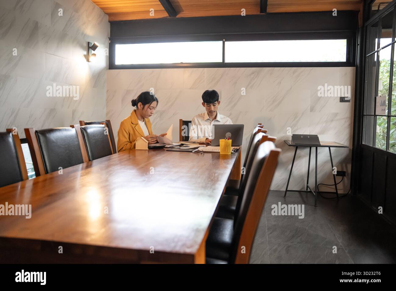 Asian Office Workers Collaborating in a Business Meeting Stock Photo ...