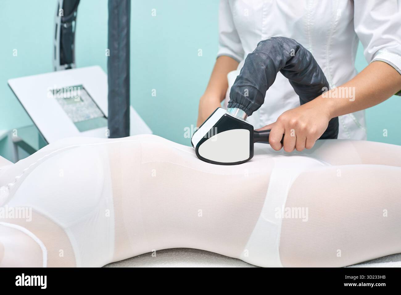 Female receiving body contouring cavitation treatment in spa clinic for ...