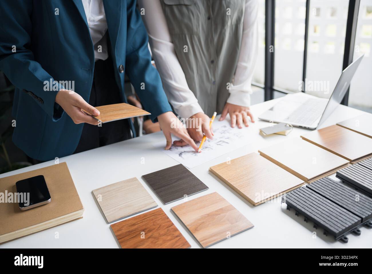 Interior designers brainstorming creative design ideas for modern home ...