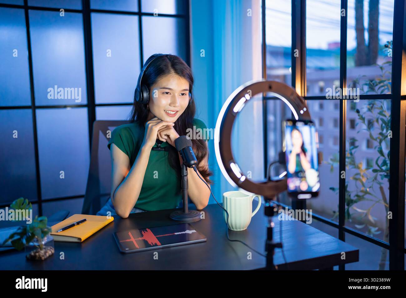 Content creator Young asian woman influencer creating content in home ...