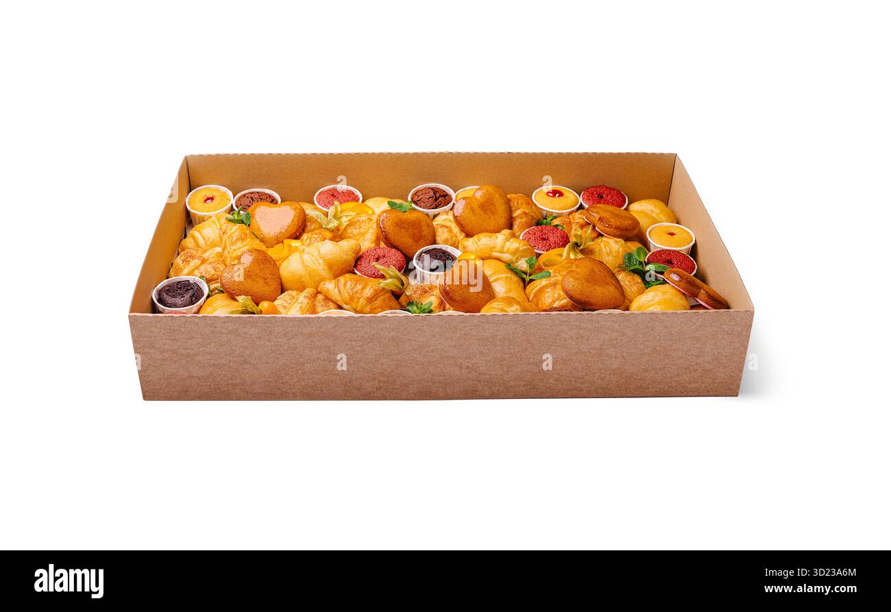 Assorted pastries displayed in a box for a dessert event Stock Photo ...