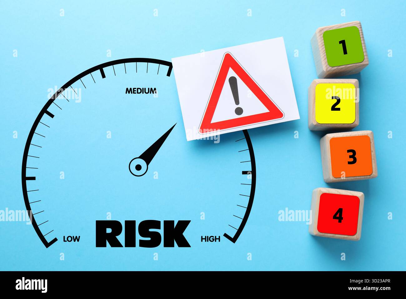 Scale with arrow indicating level of risk, warning sign and cubes with ...