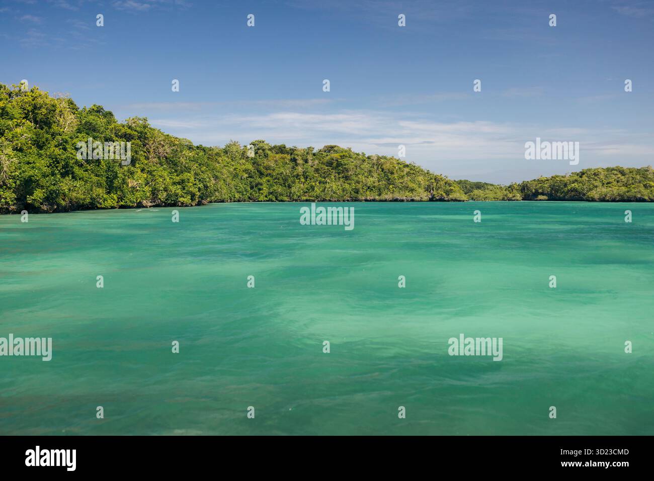 Turquoise sea with lush green islands under a clear blue sky. Pulau ...
